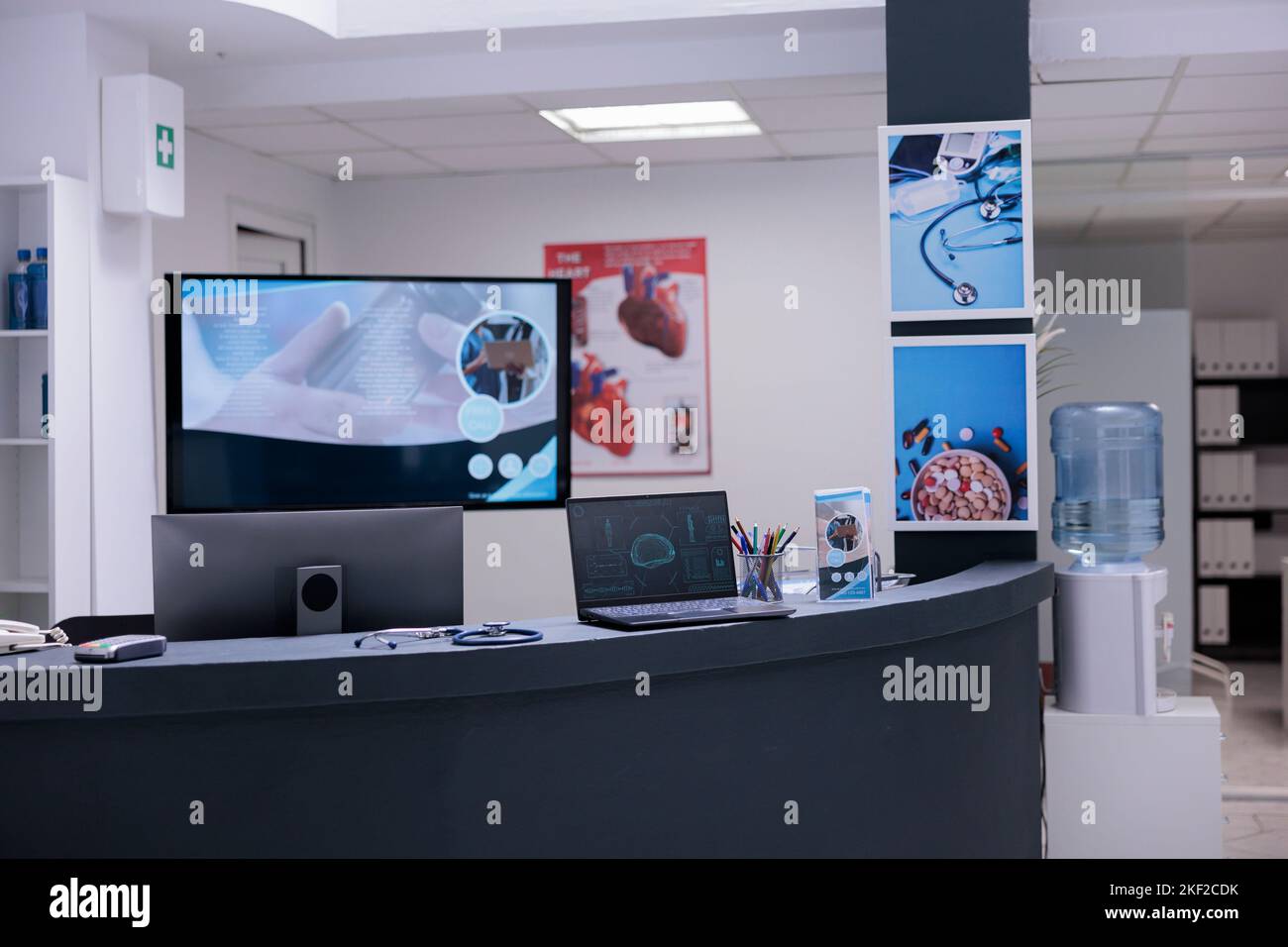 Empty customer service area counter top. Computers, posters and office ...