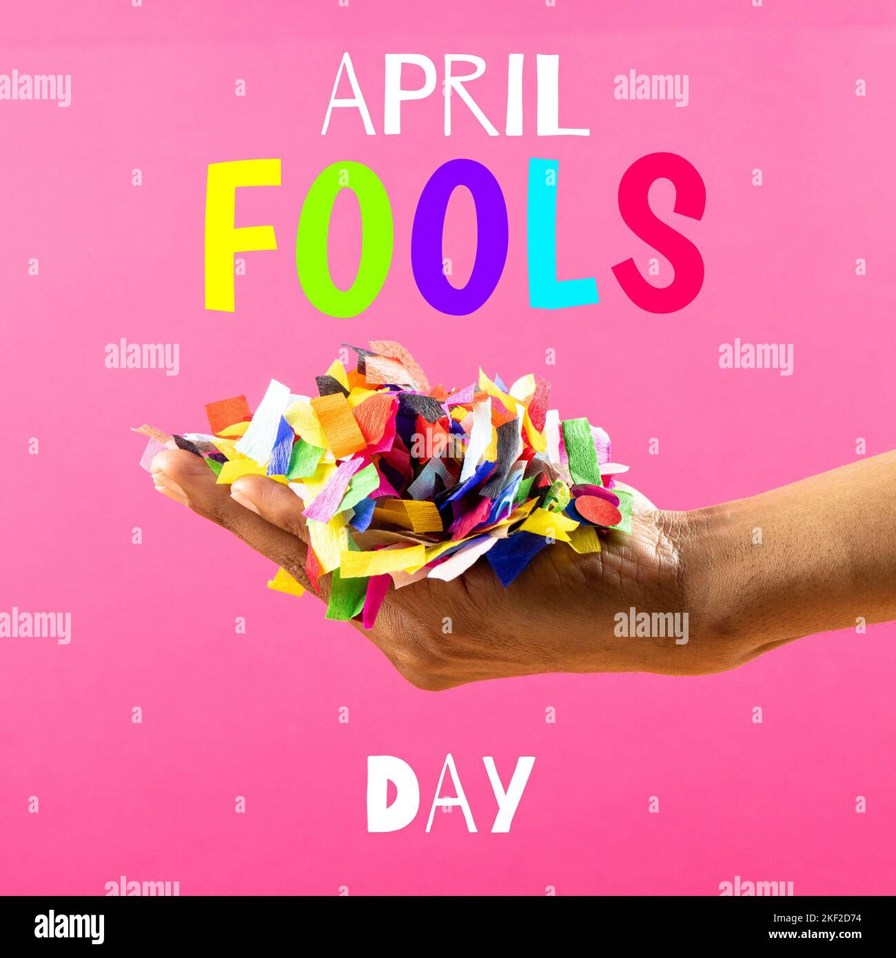 Composition of april fools day text over hand with confetti Stock Photo ...