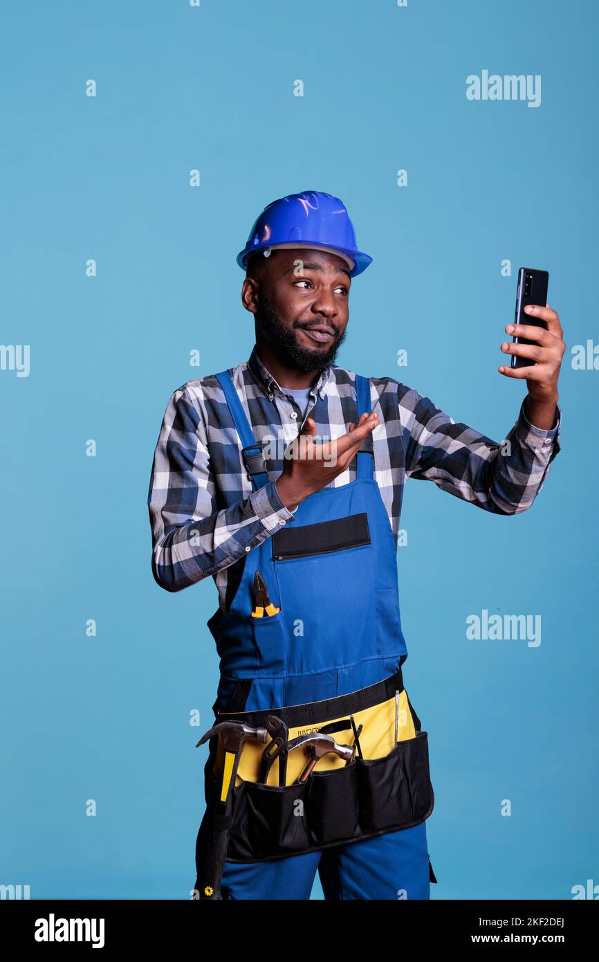 African american contractor talking on video call with business partner ...