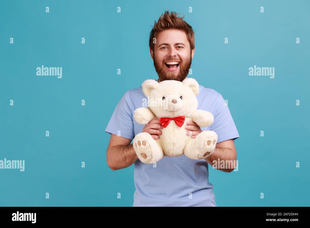 Portrait of happy optimistic handsome bearded man standing looking at ...