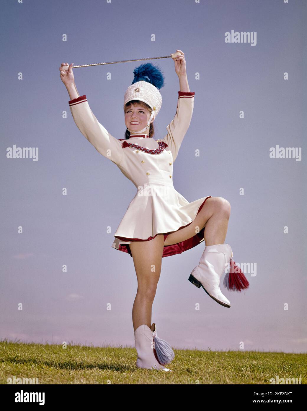 1960s WOMAN MAJORETTE WEARING SHORT SKIRT UNIFORM TASSELED BOOTS ...