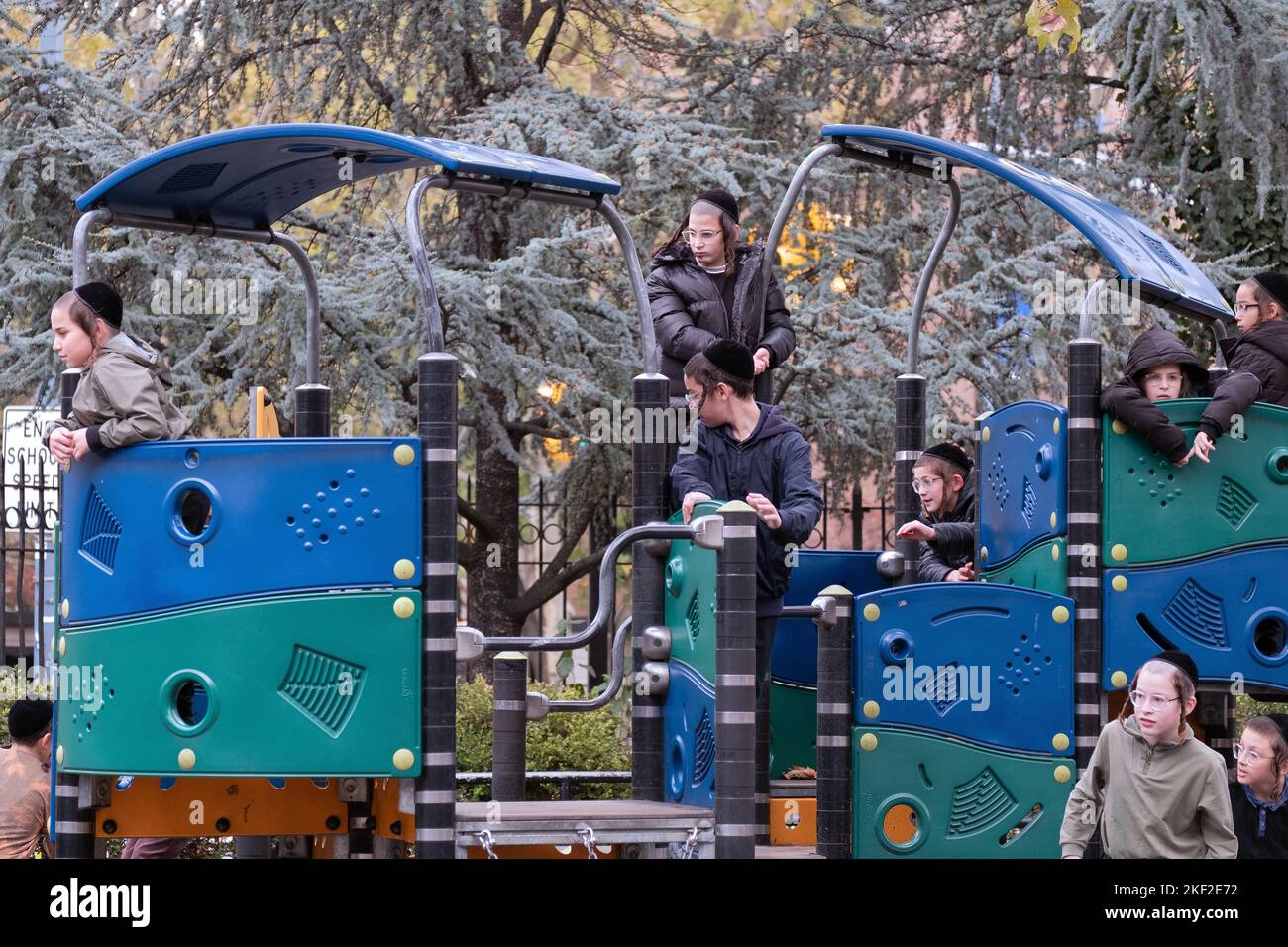 A group of orthodox Jewish students play in Sobel Playground during ...