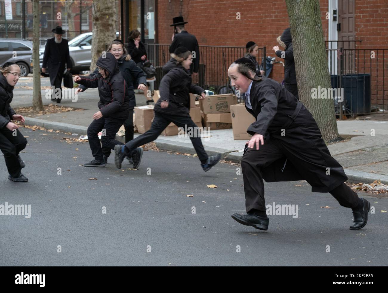 Orthodox Jewish yeshiva students play a game of tag during Recess. In ...