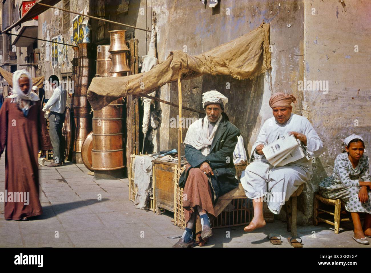 1960s STREET SCENE IN OLD NATIVE BAZAAR SOUK OF CAIRO EGYPT IDLE MEN ...