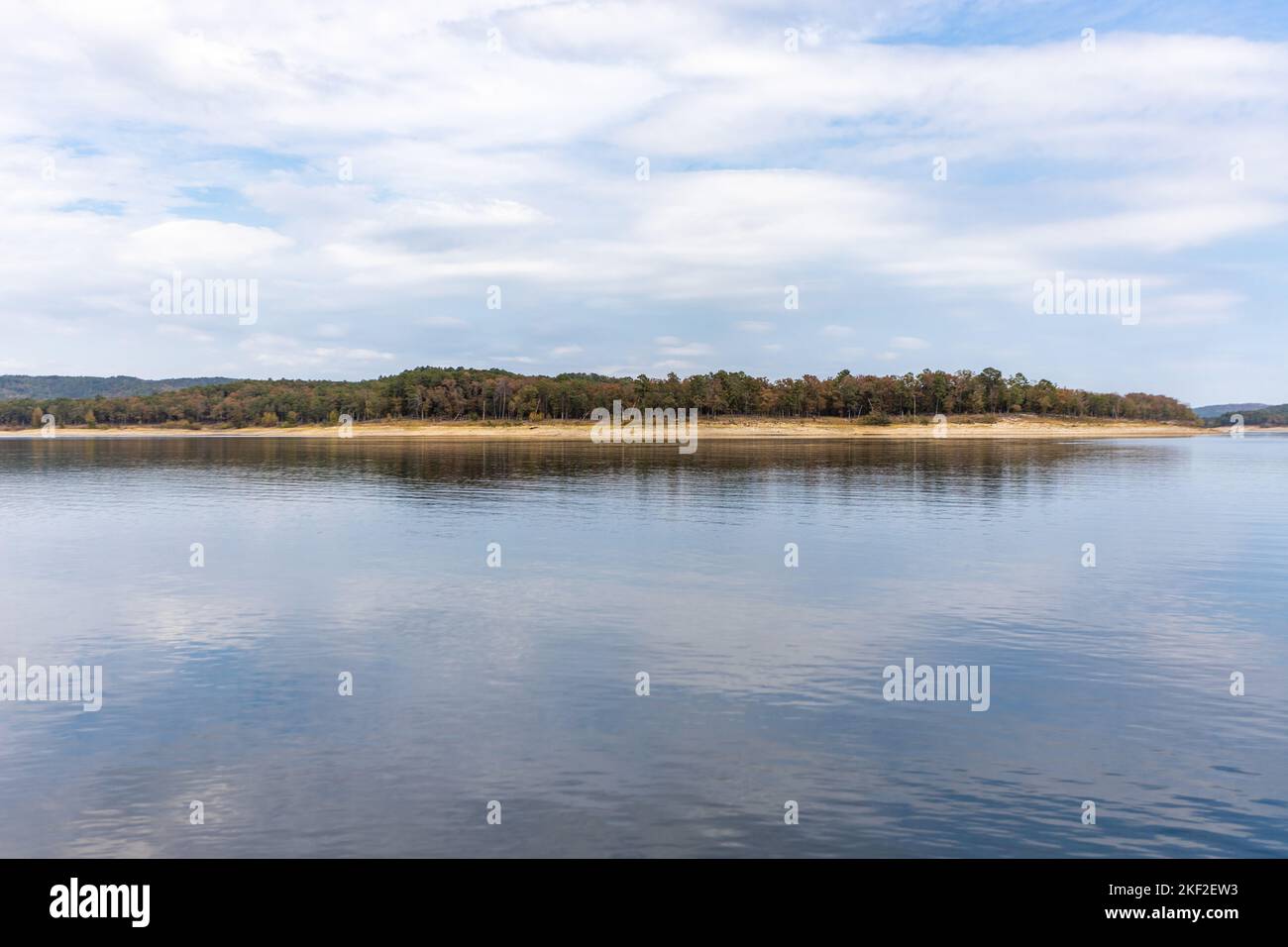 Beautiful landscape with blue sky and smooth lake surface, forest and ...