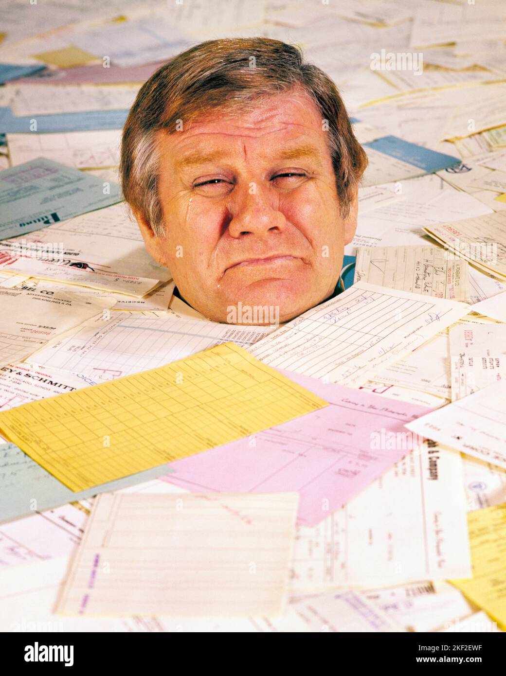 Man buried in paperwork hi-res stock photography and images - Alamy