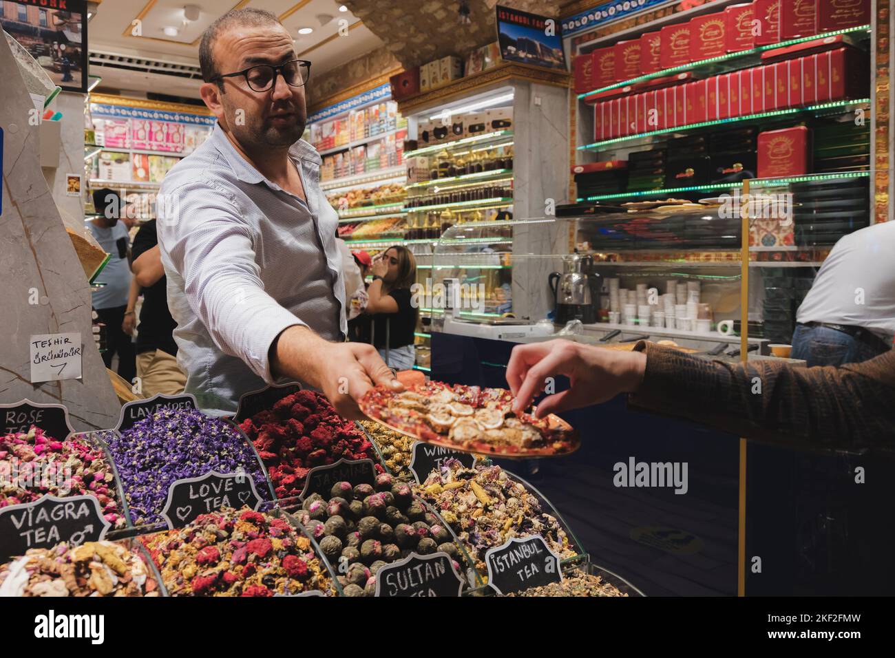 Istanbul, Turkey - October 1 2022: A shop vendor gives out samples of ...