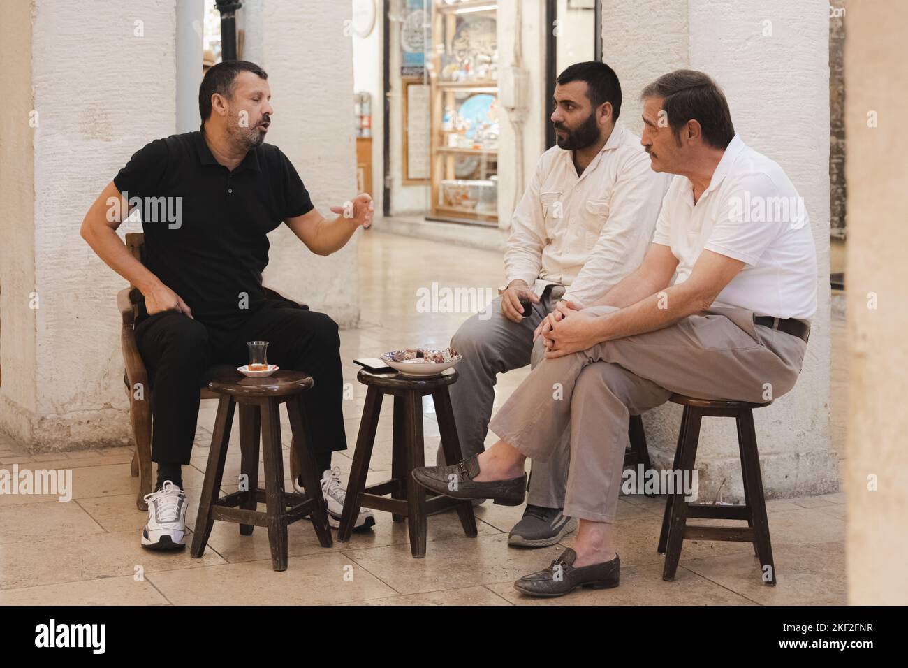 Istanbul, Turkey - October 1 2022: Turkish men socialise and chat over ...