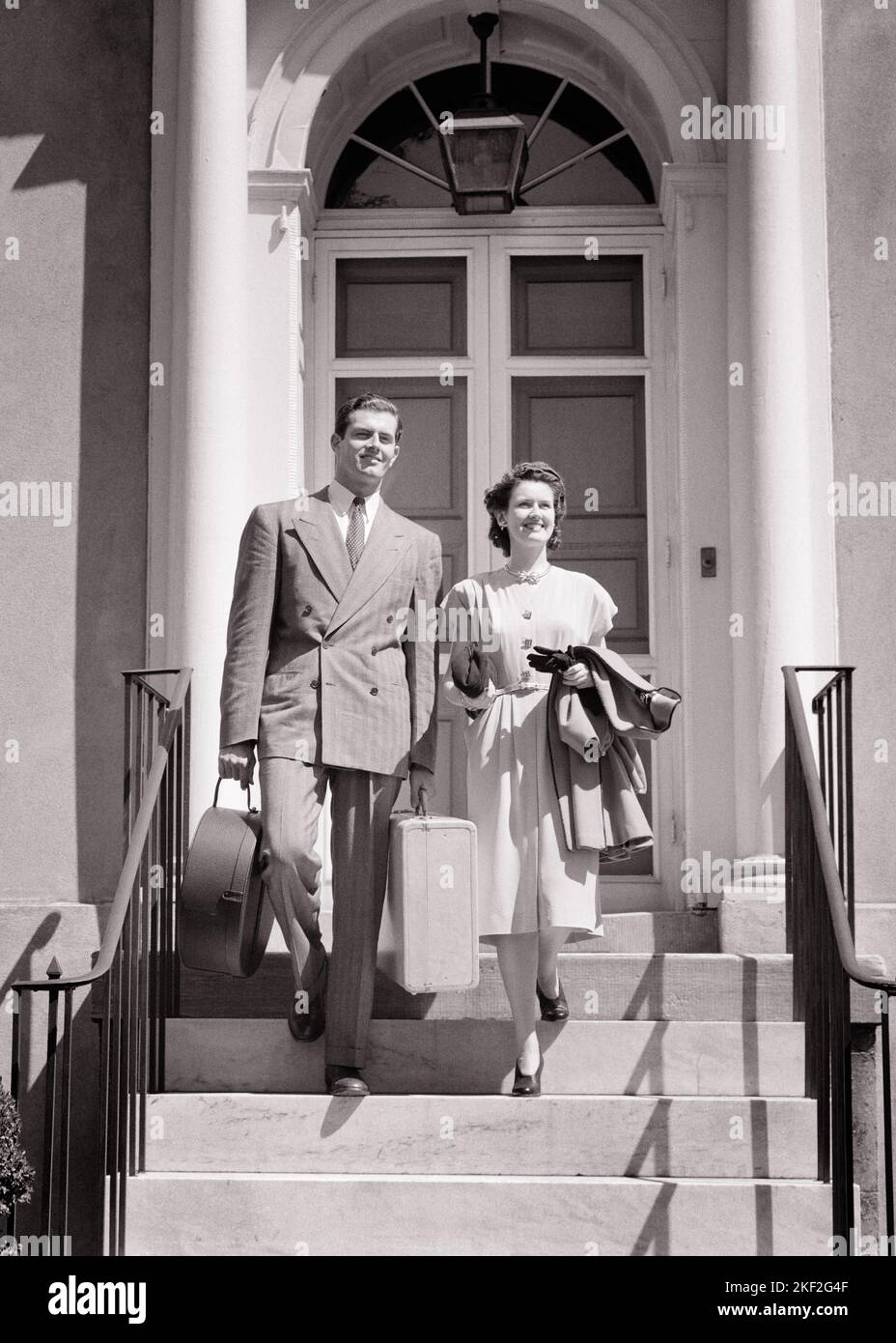 Woman 1940s walking suitcase hi-res stock photography and images - Alamy