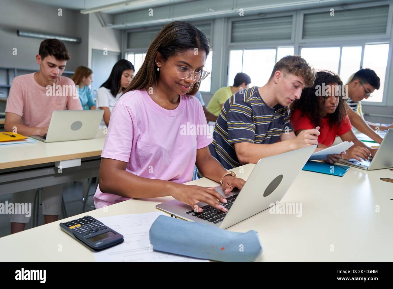 International students in class using laptop to work, concentrated ...