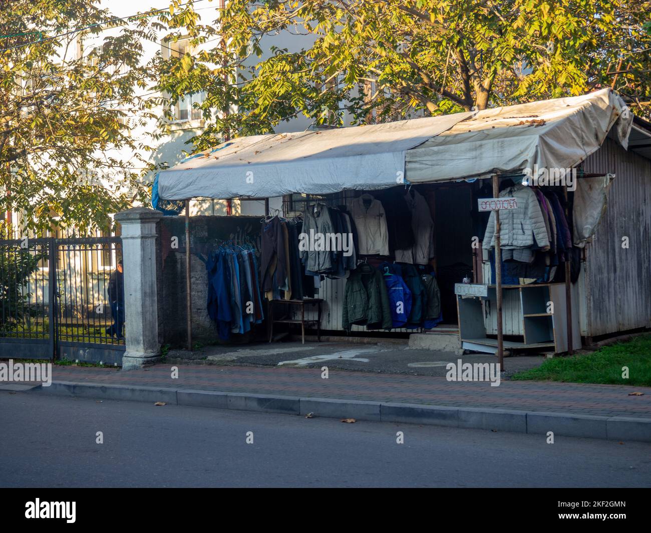 Sale of old clothes in a stall. Sale of jackets. On the outskirts of ...