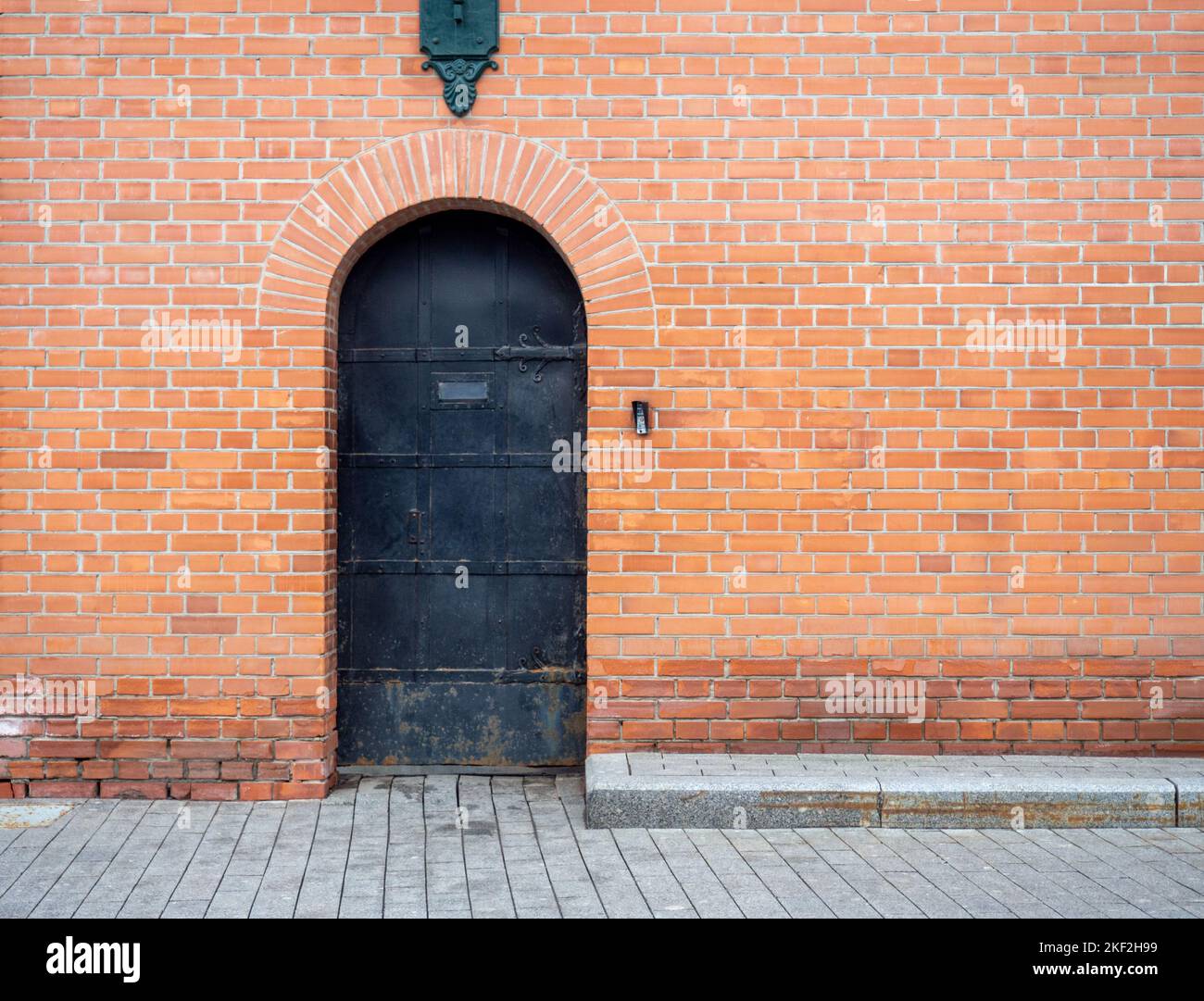 Powerful door in a brick wall. Old red brickwork. Kremlin wall. Iron ...