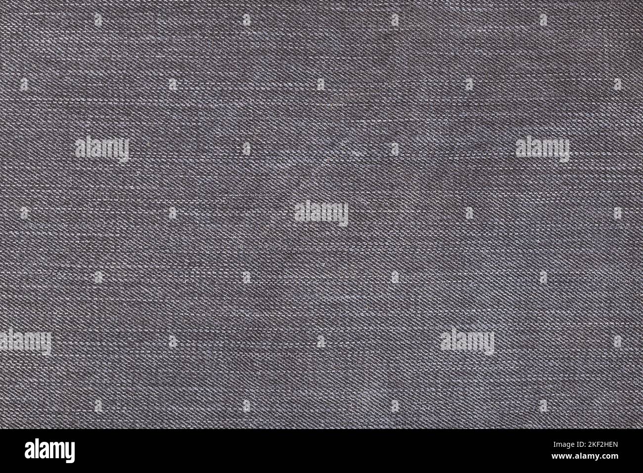 A denium gray jean closeup, background with space for text. View of old ...