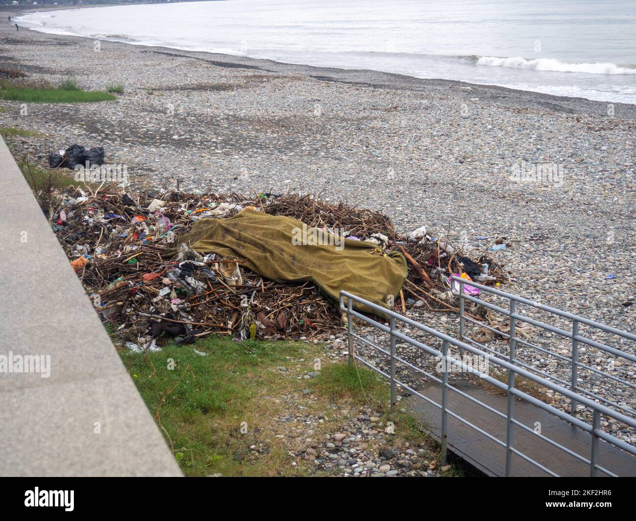 Landfill on the seashore. Depressive mood. Environmental pollution ...