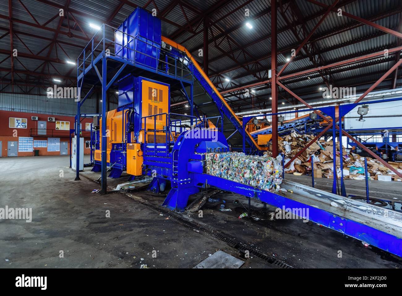 Modern waste processing plant. Sorting, pressing and packing of garbage ...