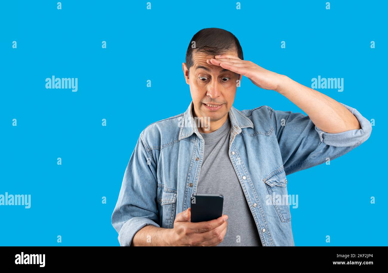 Studio shot of a handsome man texting using smartphone over isolated ...