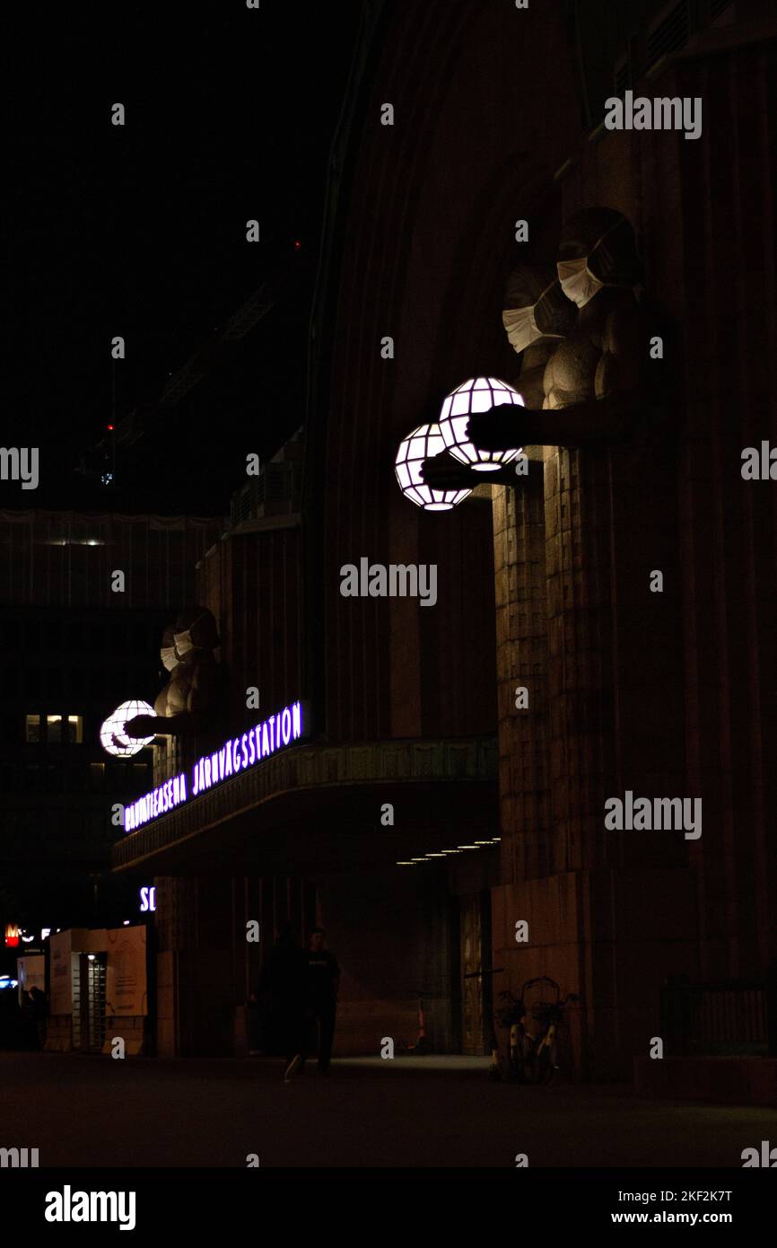 Lantern Carriers Helsinki wearing masks Stock Photo - Alamy