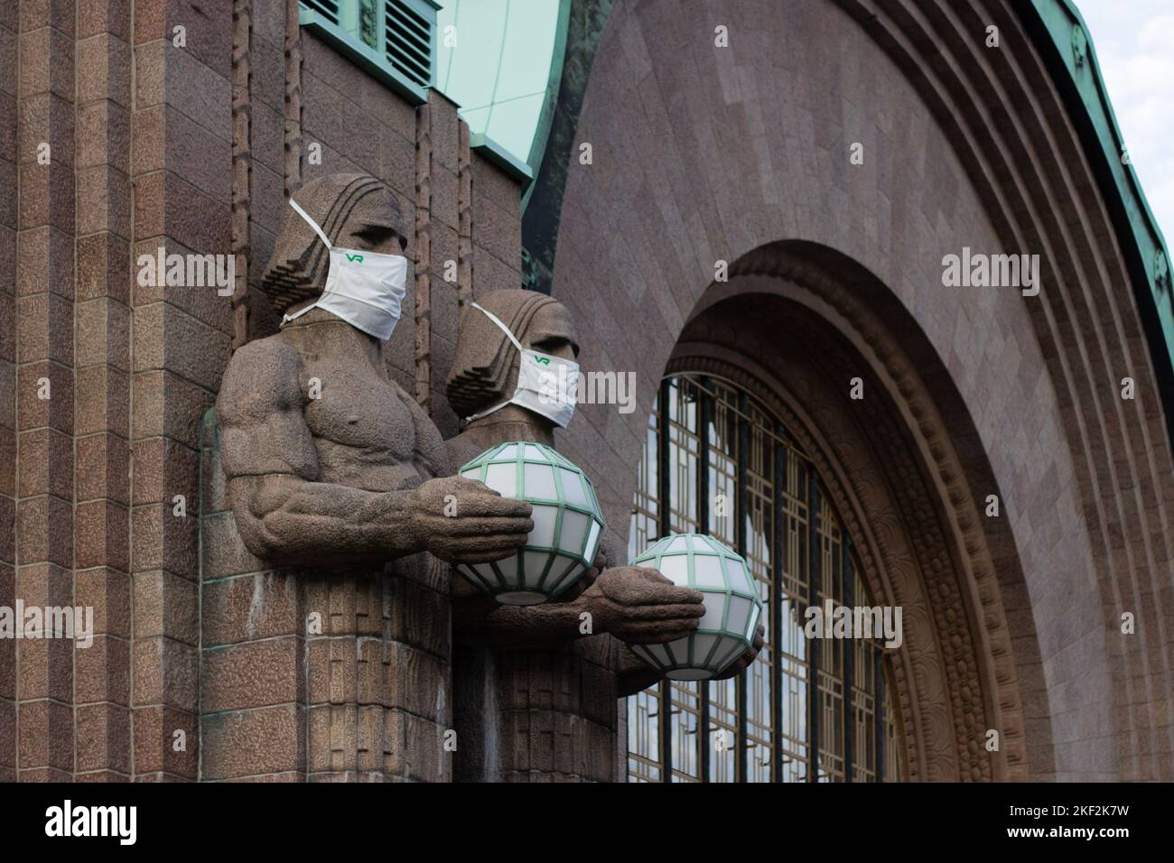 Lantern Carriers Helsinki wearing masks Stock Photo - Alamy