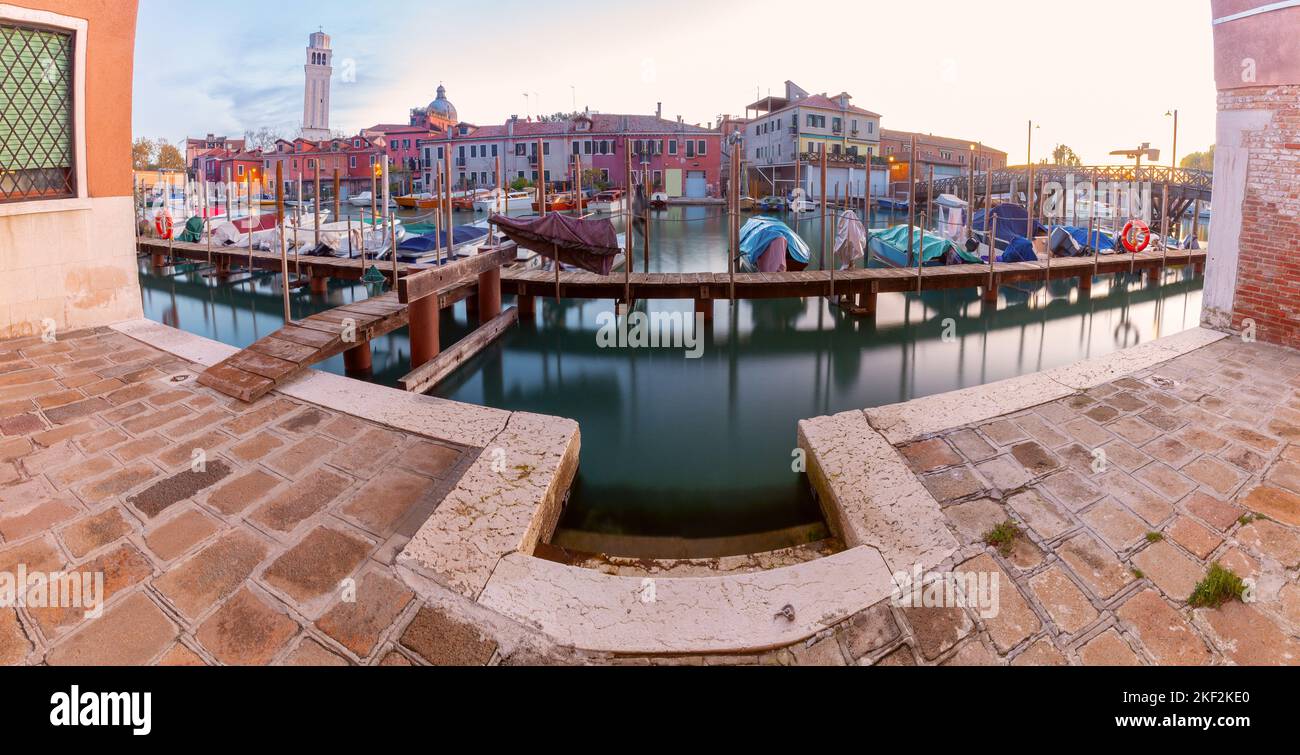 Panoramic view of colorful Venetian traditional houses along the canal ...