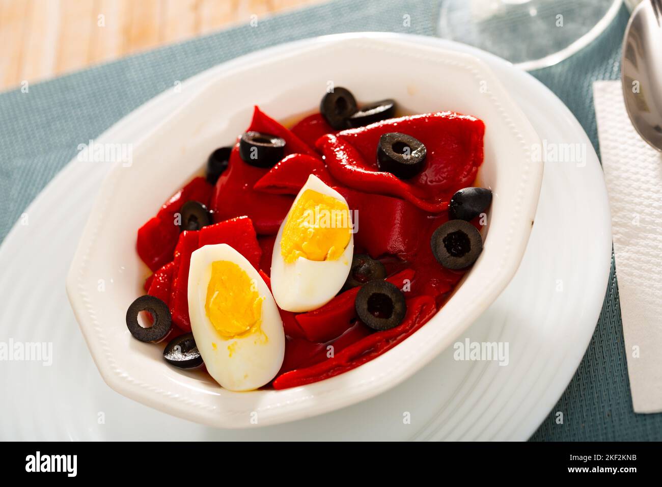 Salad of baked red peppers with boiled egg and olives Stock Photo - Alamy