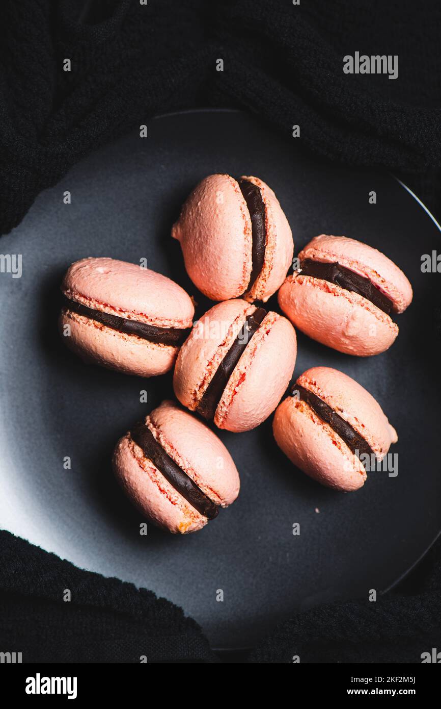 Pink French macarons with a chocolate ganache filling Stock Photo - Alamy