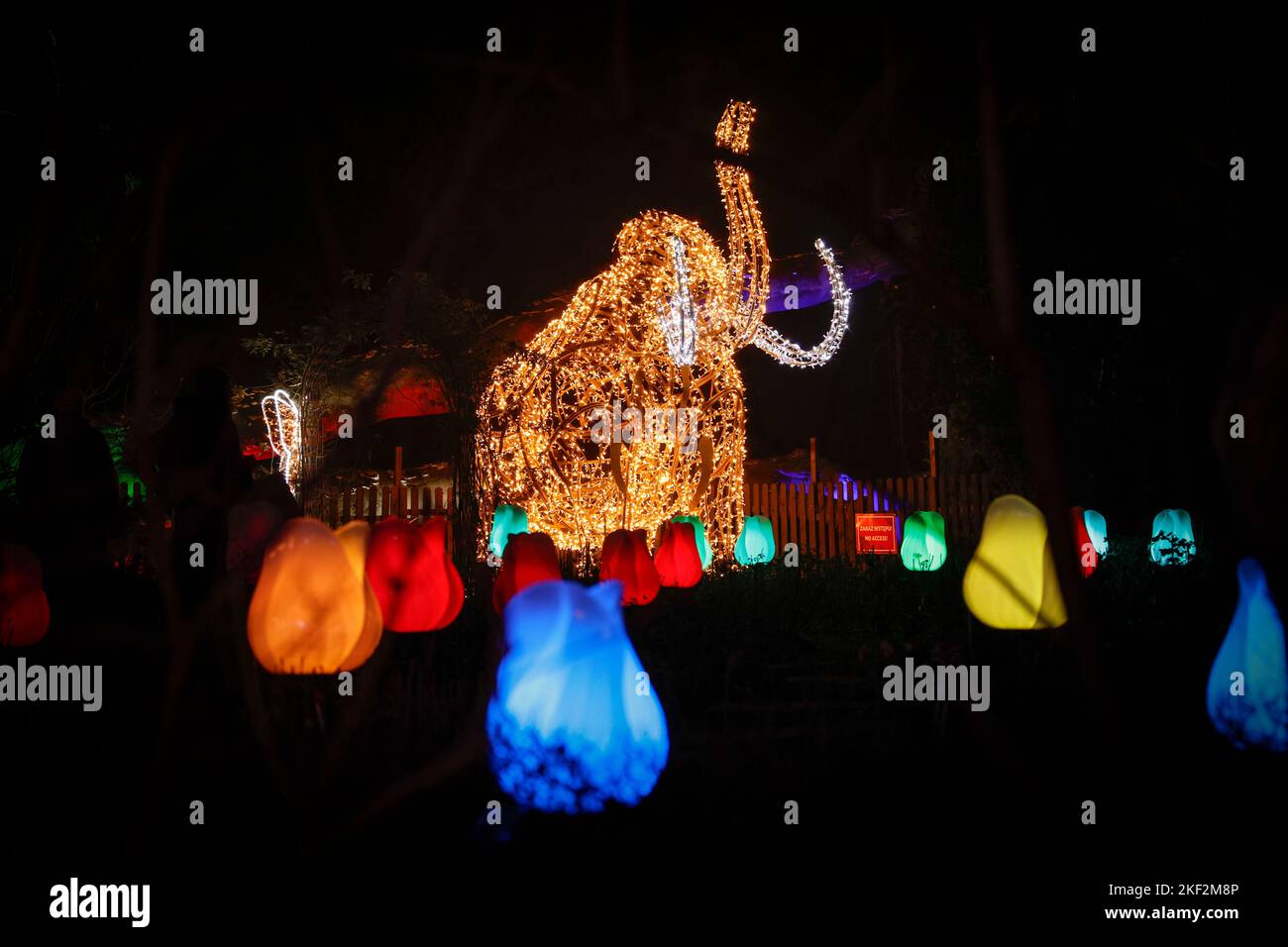 A sculpture decorated with colored lights in the shape of a large ...