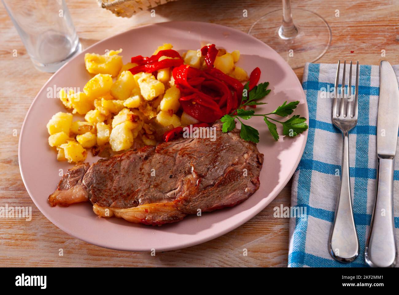 Beef entrecote with fried potato and baked sweet pepper Stock Photo - Alamy