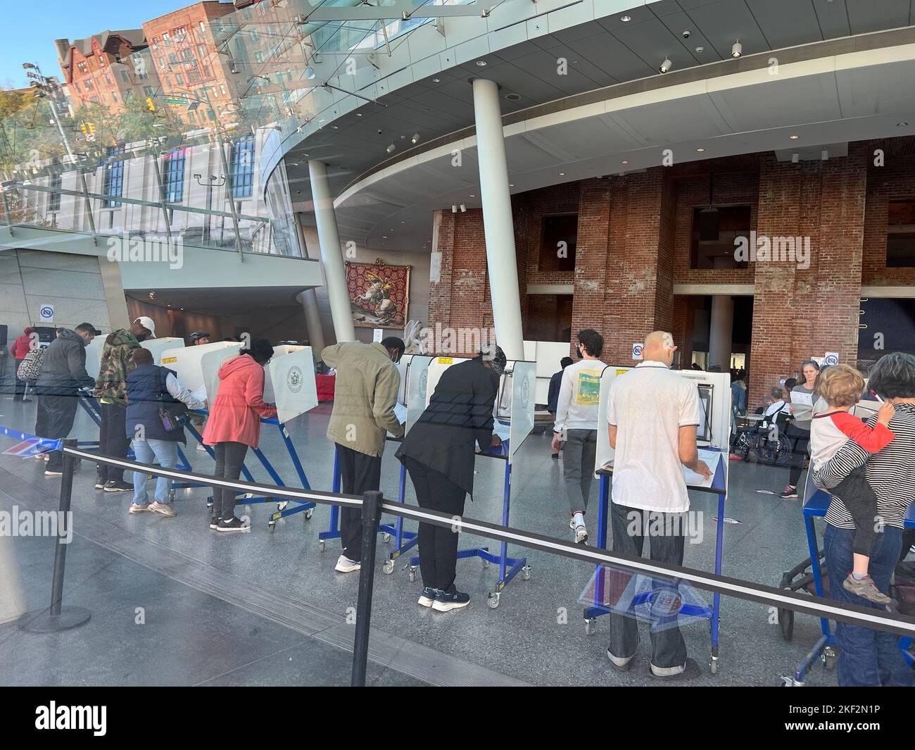 People early voting in the 2022 midterm elections in the outer lobby of ...