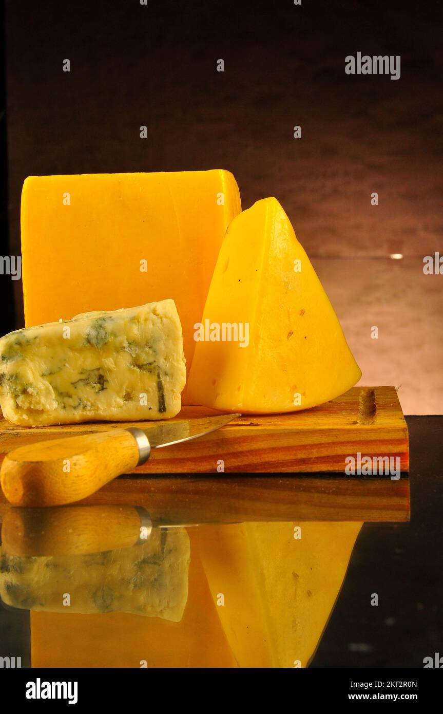 Table with a mix of different cheeses Stock Photo - Alamy