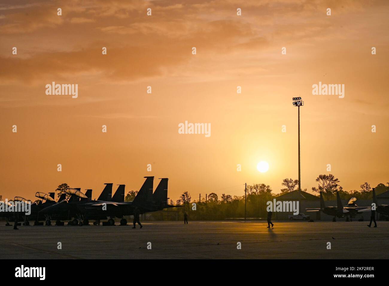Multiple Airmen conduct a foreign object debris (FOD) walk prior to the ...