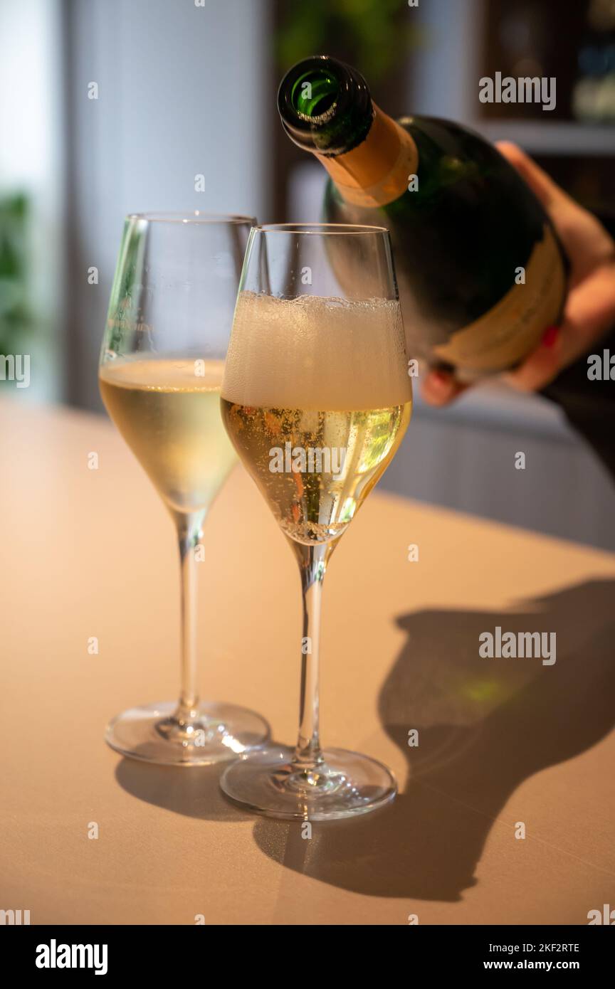 Tasting of brut and reserve grand cru champagne sparkling wine produced by traditional method in ...