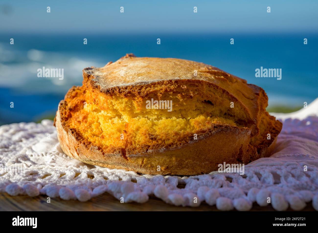 Portugeese homemade oven baked yellow corn bread served outdoor with ...