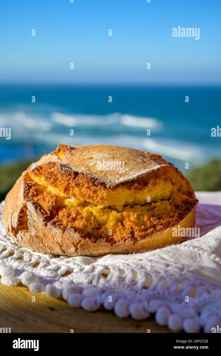 Portugeese homemade oven baked yellow corn bread served outdoor with ...