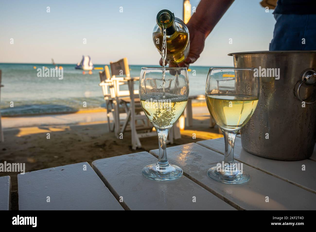 Drinking of cold white wine in beach bar, summer holidays, relax on ...
