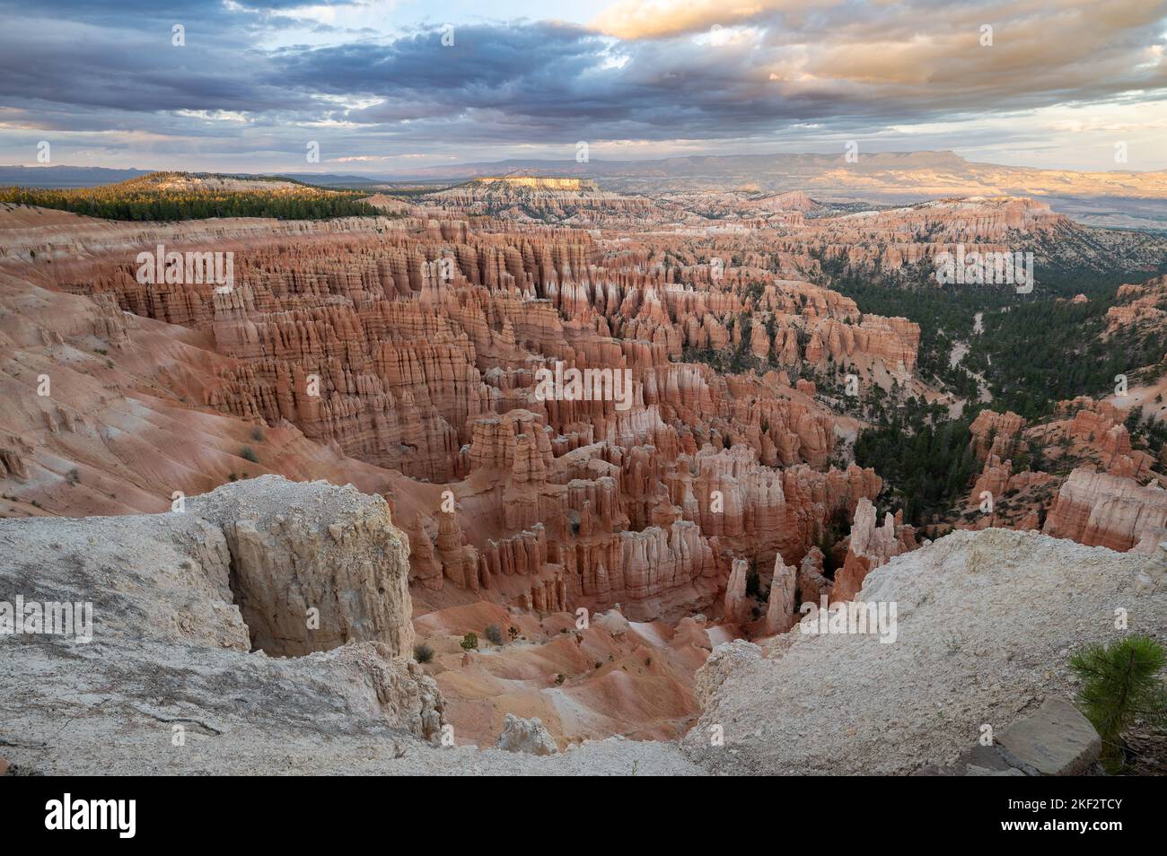 A red rocky canyon with golden sunset background Stock Photo - Alamy