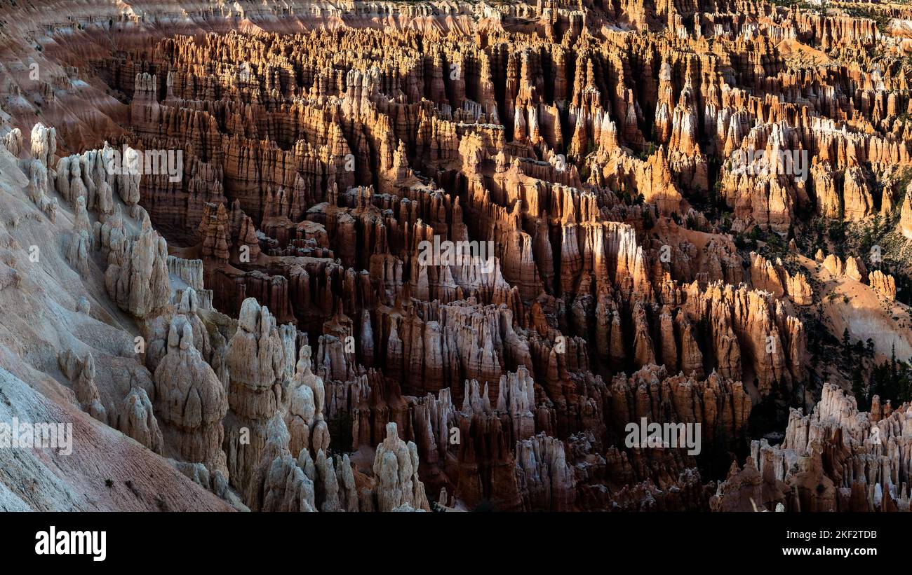 A red rocky canyon with golden sunset background Stock Photo - Alamy