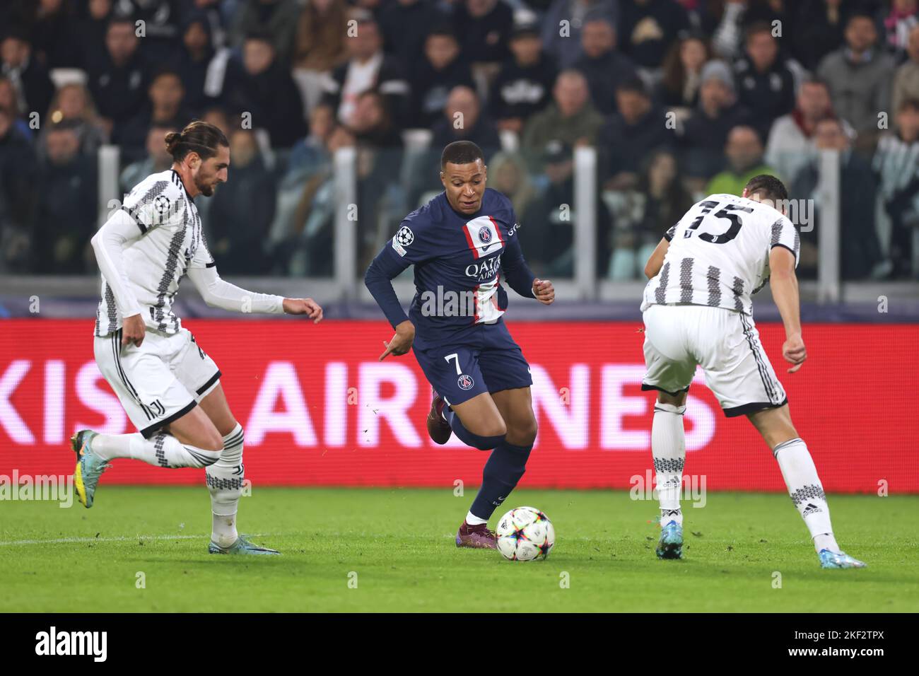 Turin, Italy, 2nd November 2022. Kylian Mbappe of PSG takes on Adrien ...
