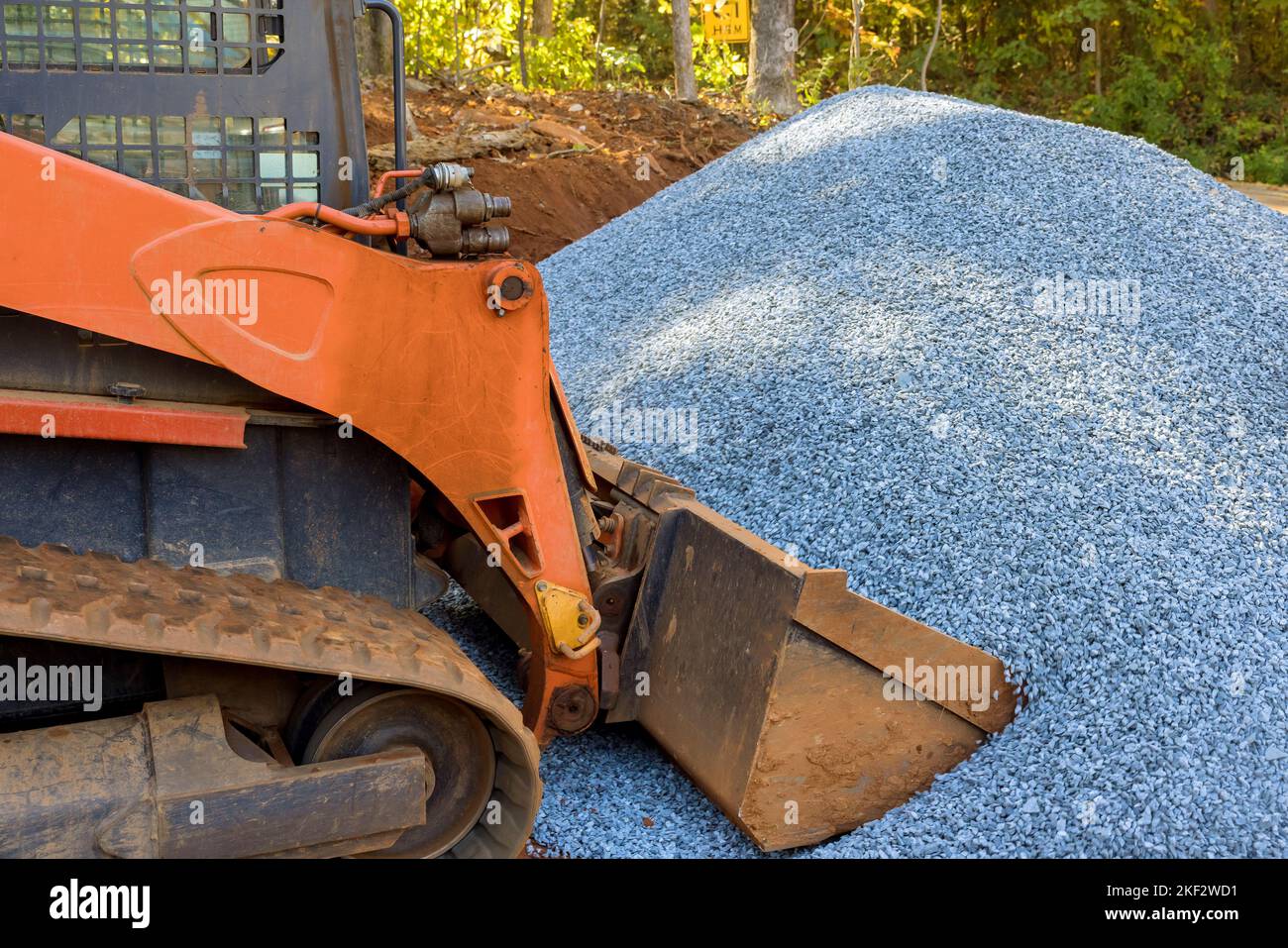 Wheel loader excavator for unloading crushed stone during repair road ...