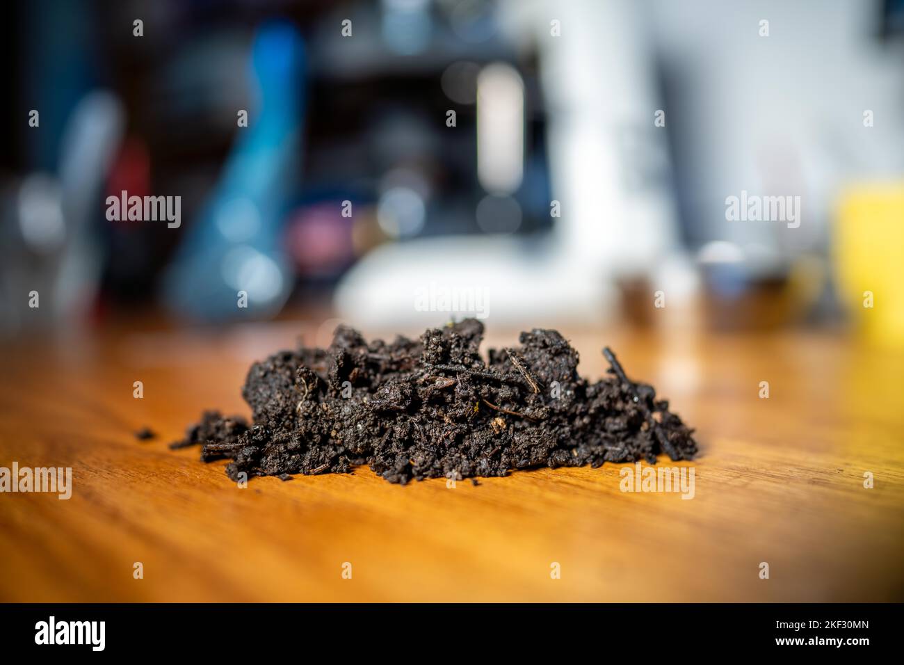 conducting a soil test in a home lab. soil on a table. brown dirt in a ...