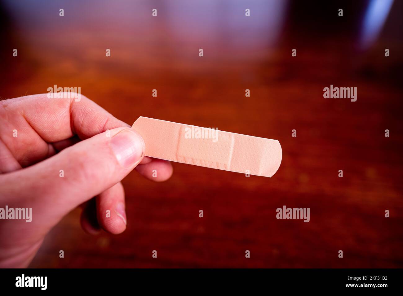 using a band aid on a hand in care Stock Photo - Alamy