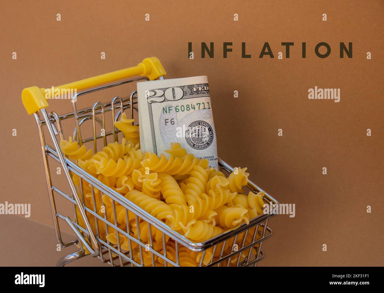 INFLATION text against Shopping trolley cart Filled With Pasta with 20 ...
