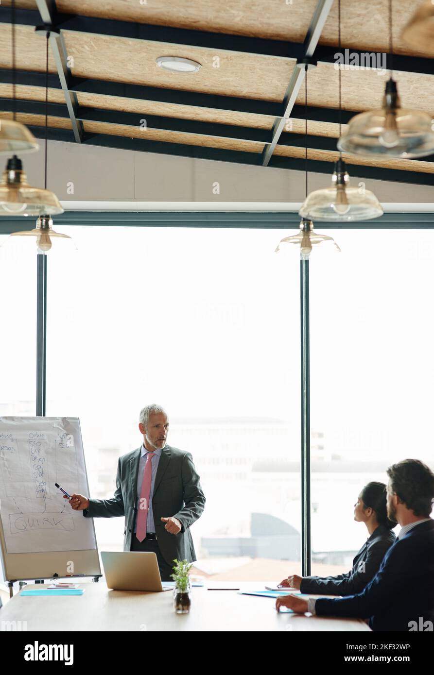 Putting their minds to task. a group of executives having a meeting in ...