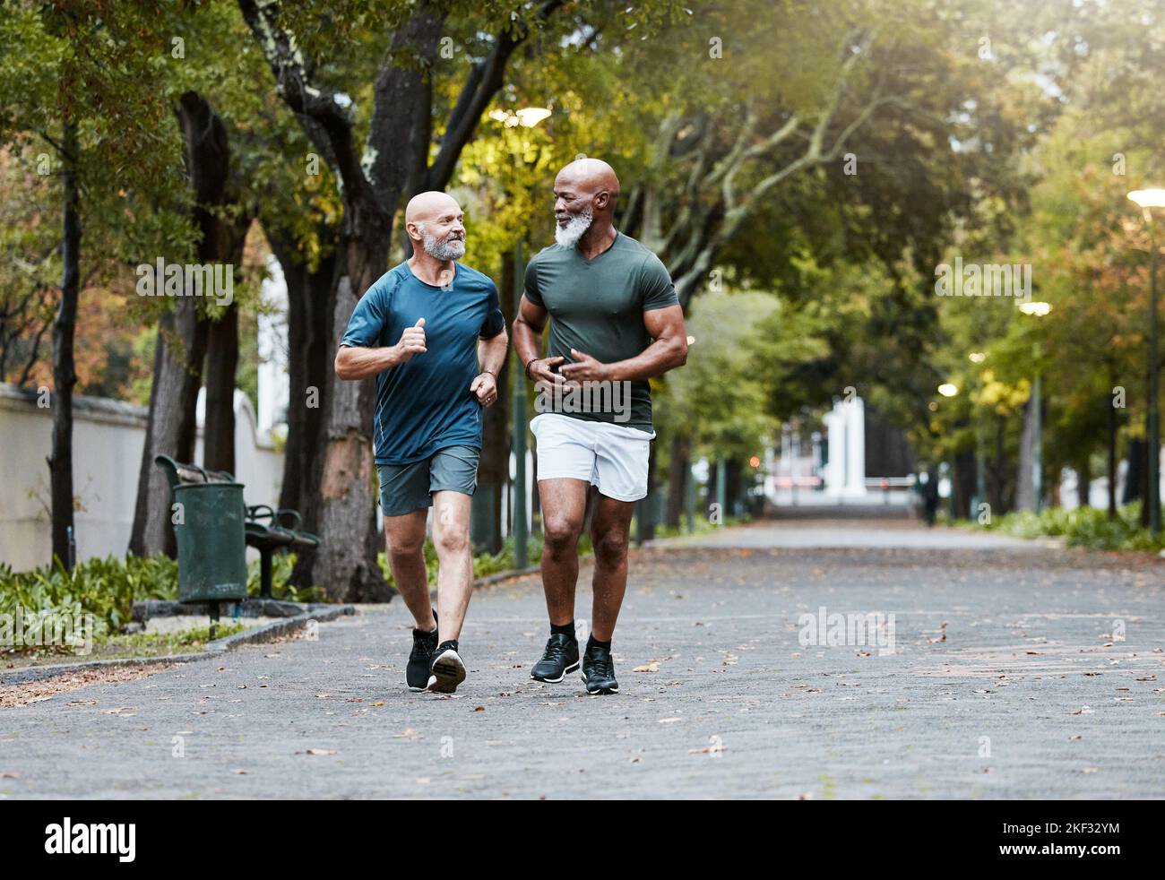 Mature, men and fitness with friends running in park for exercise ...
