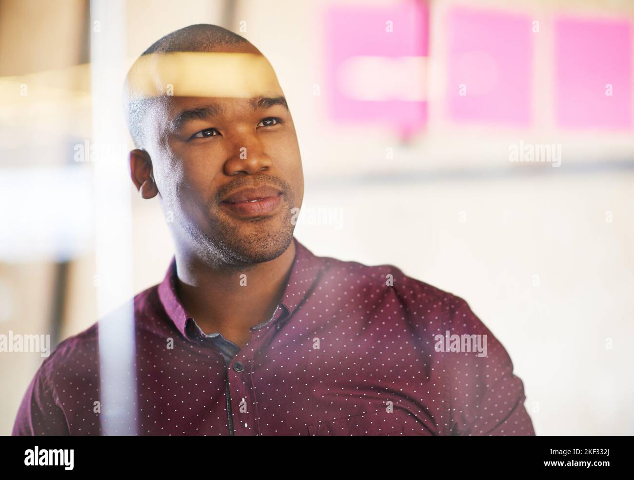 Its all about thinking outside the box. a male designer looking at ...