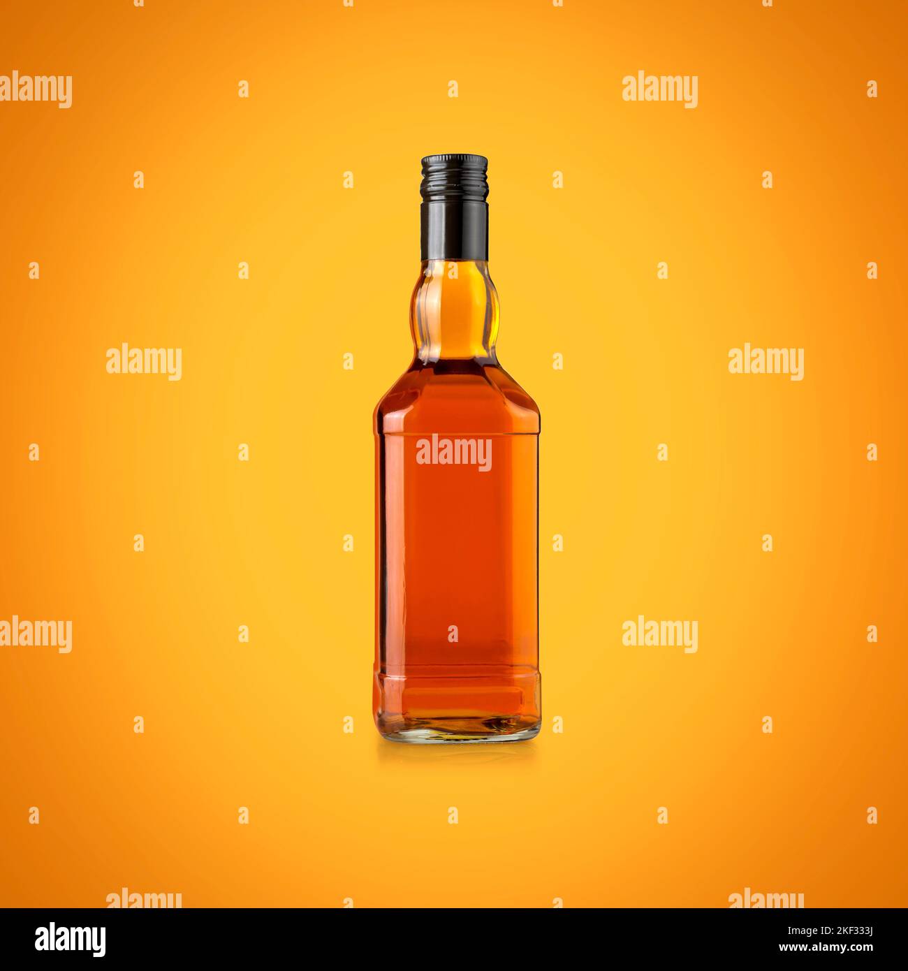 whiskey bottle blank on brown background place for text, with clipping ...