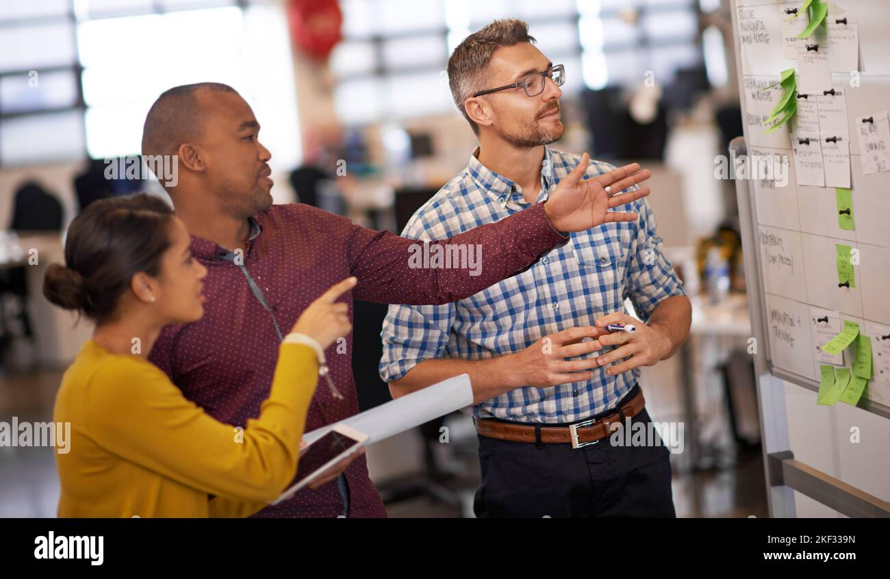 Brainstorming- creating more ideas in less time. a group of coworkers ...