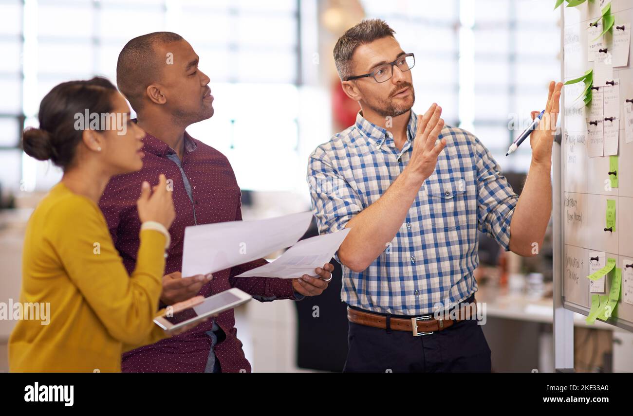 Problem-solving professionals at work. a group of coworkers ...