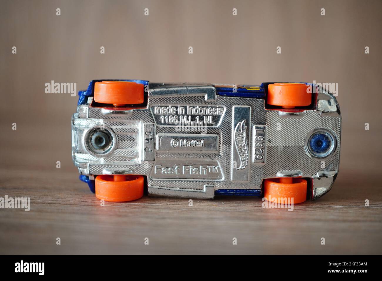 A Mattel Hot Wheels toy model Fast Fish race car laying on the side ...