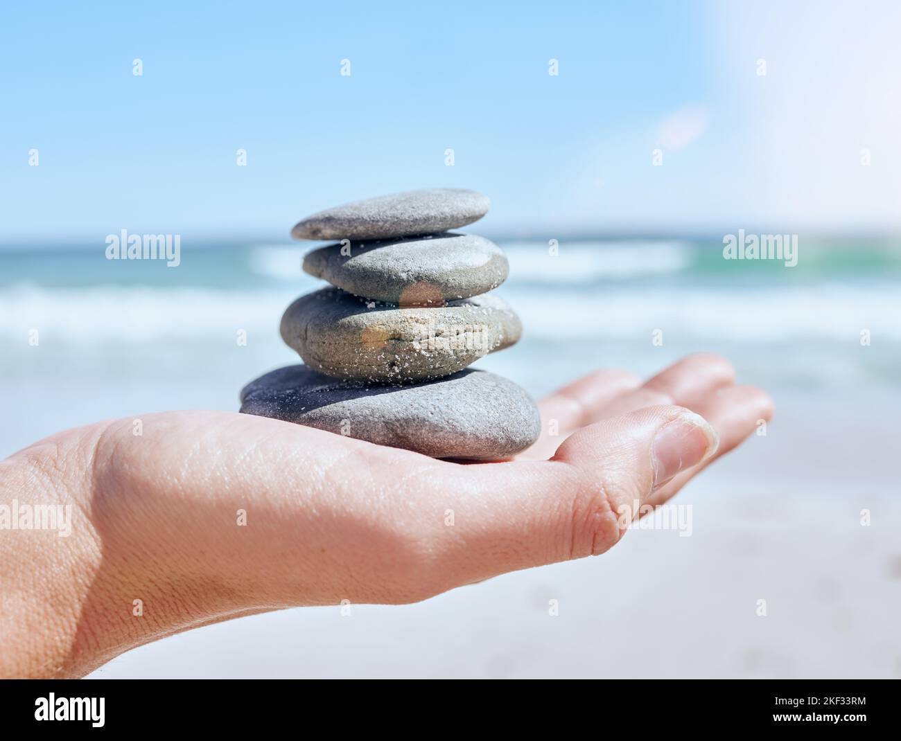 Hand holding stone beach hi-res stock photography and images - Alamy