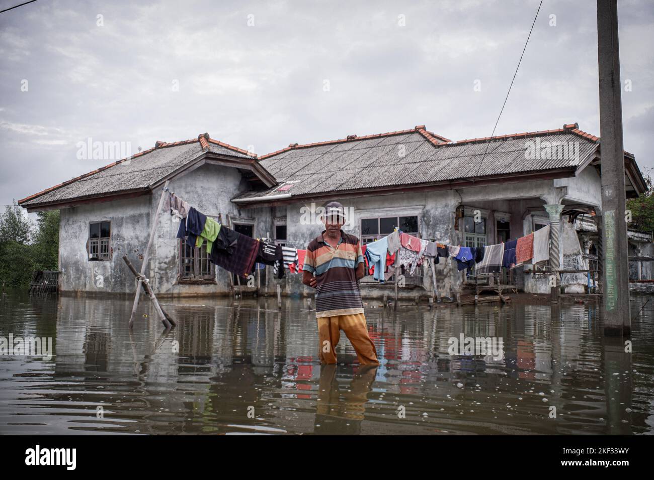 Bekasi, Indonesia. 7th Nov, 2022. Tebe (63), a fisherman stands in a ...